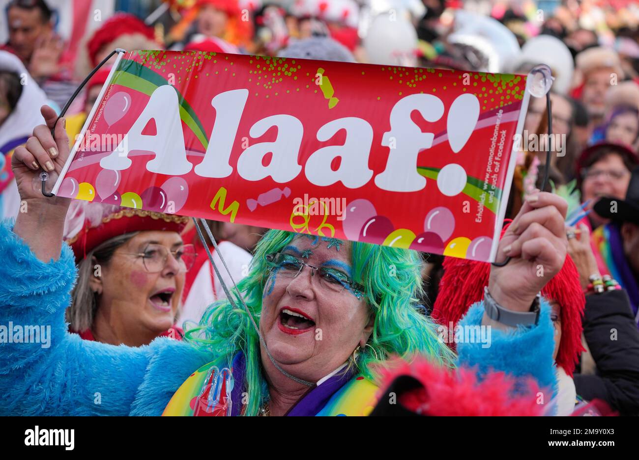 A carnival reveller holds a sing reading the traditional carnival ...