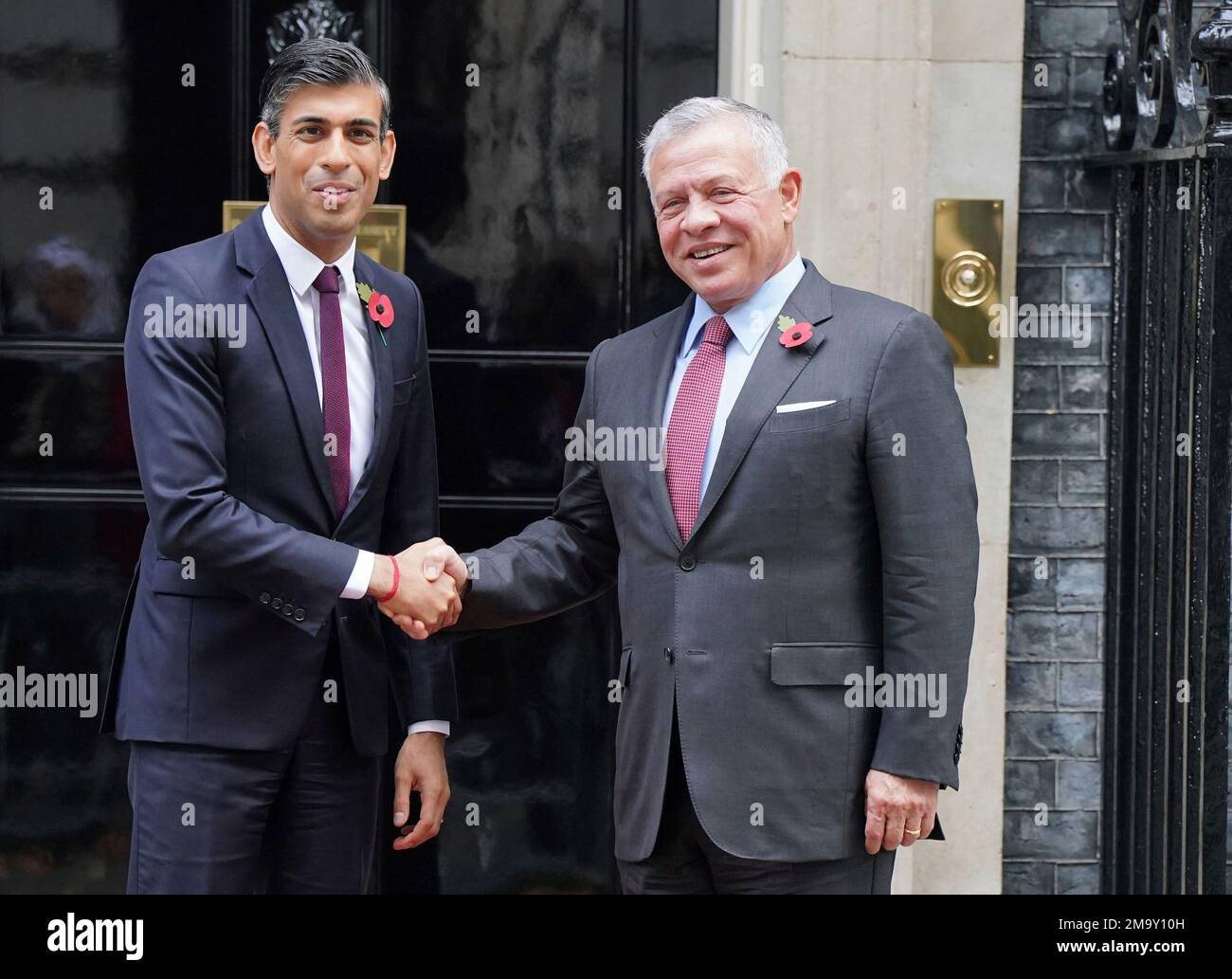 British Prime Minister Rishi Sunak shakes hands with King Abdullah II ...