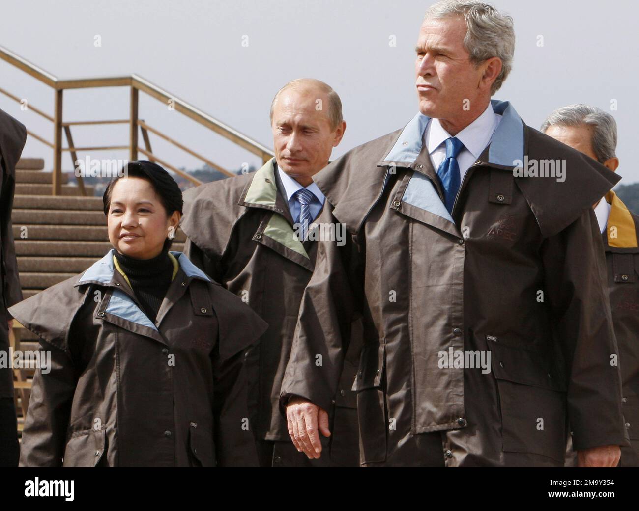 FILE - U.S. President George W. Bush, right, wears a Drizabone jacket ...