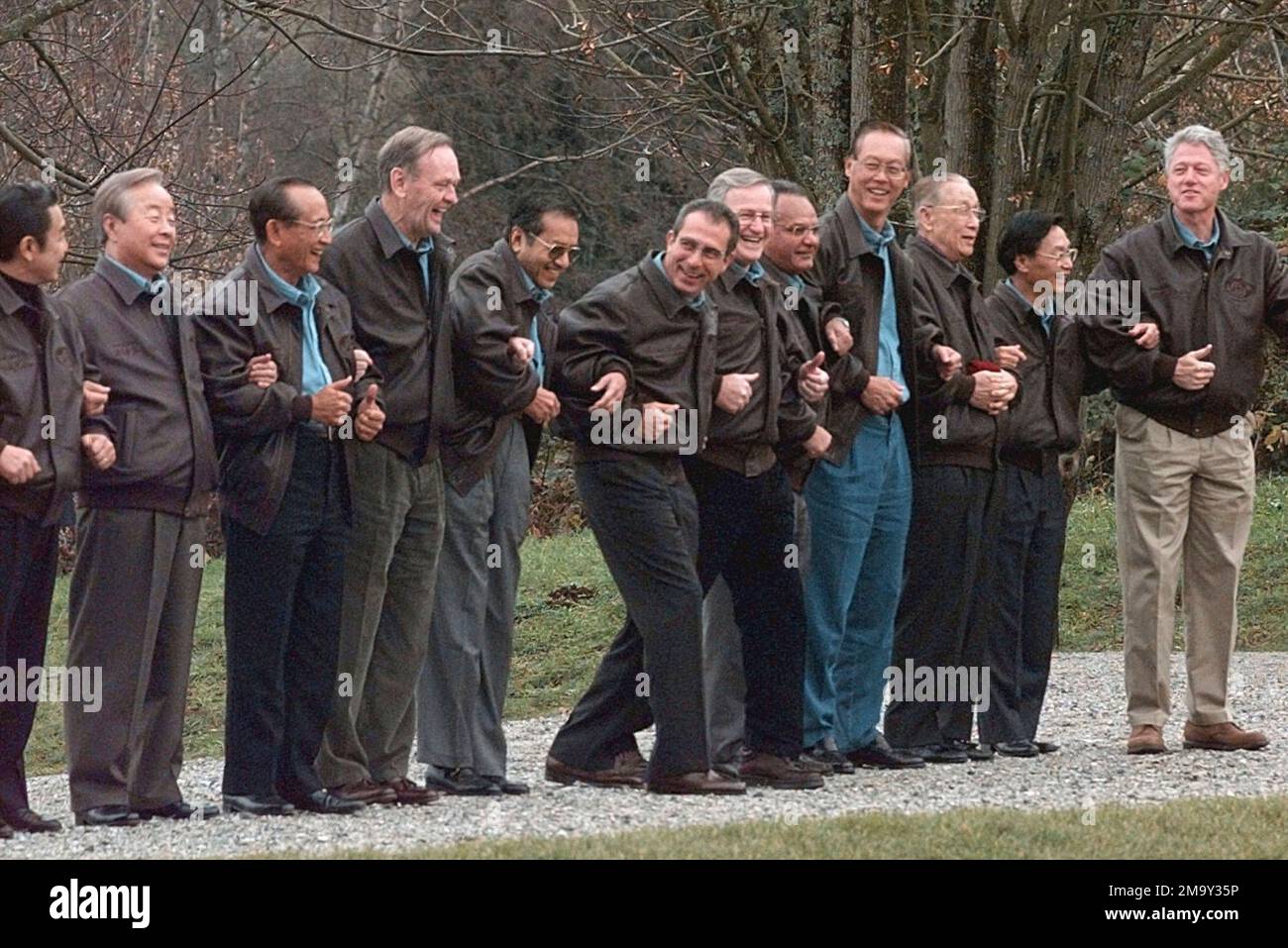 FILE - APEC leaders, wearing matching jackets, laugh during a group ...