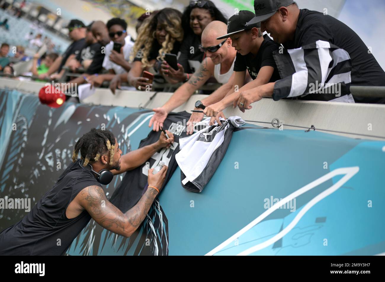 Las Vegas Raiders safety Roderic Teamer interacts with fans in the ...