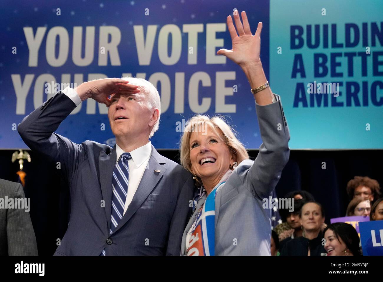 President Joe Biden looks into the crowd as first lady Jill Biden waves ...