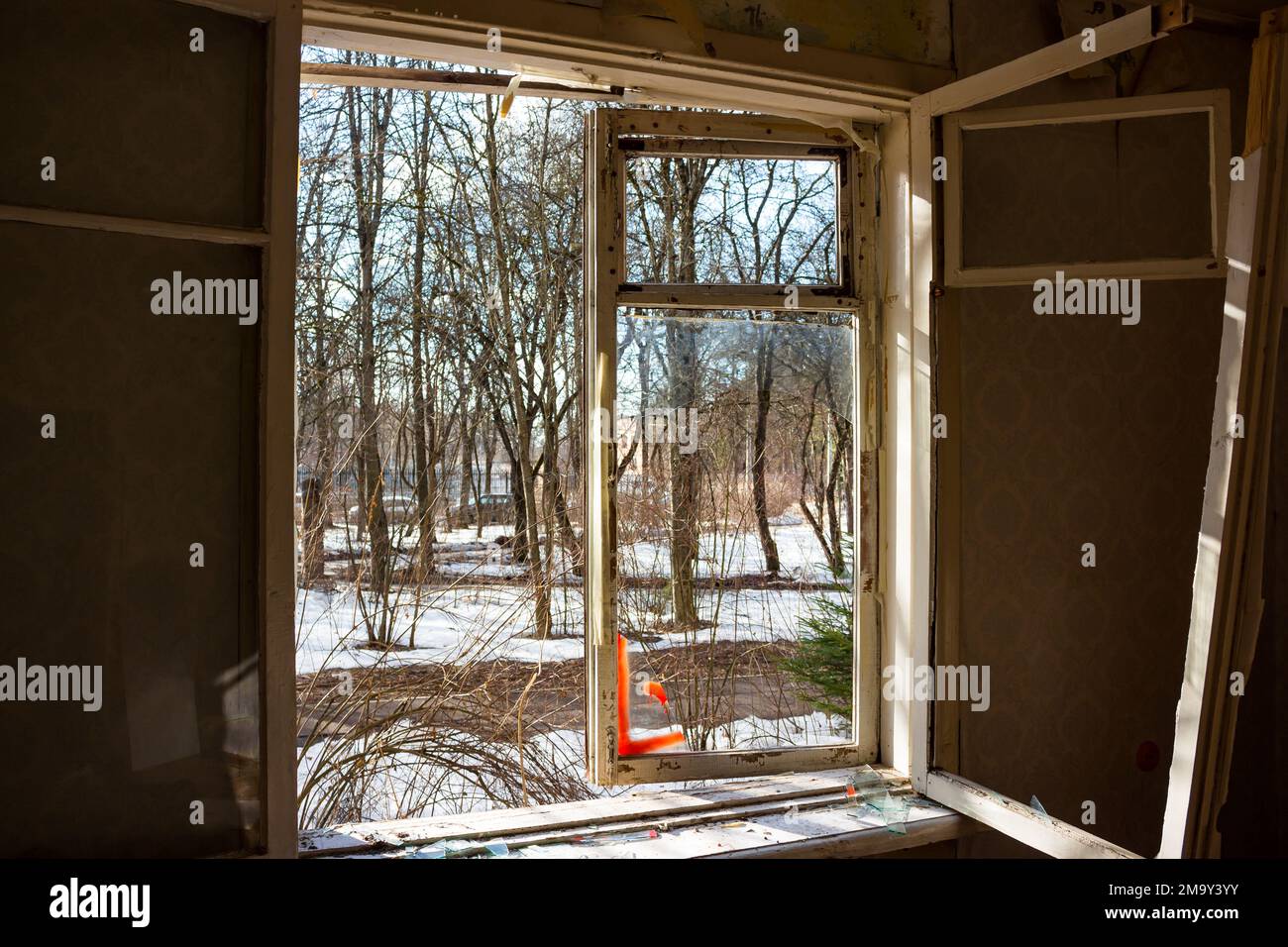 Broken window in an abandoned house, view from the room Stock Photo - Alamy
