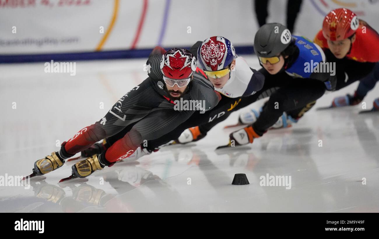 Canada's Steven Dubois, left, skates during the men's 1,000 meter heat ...