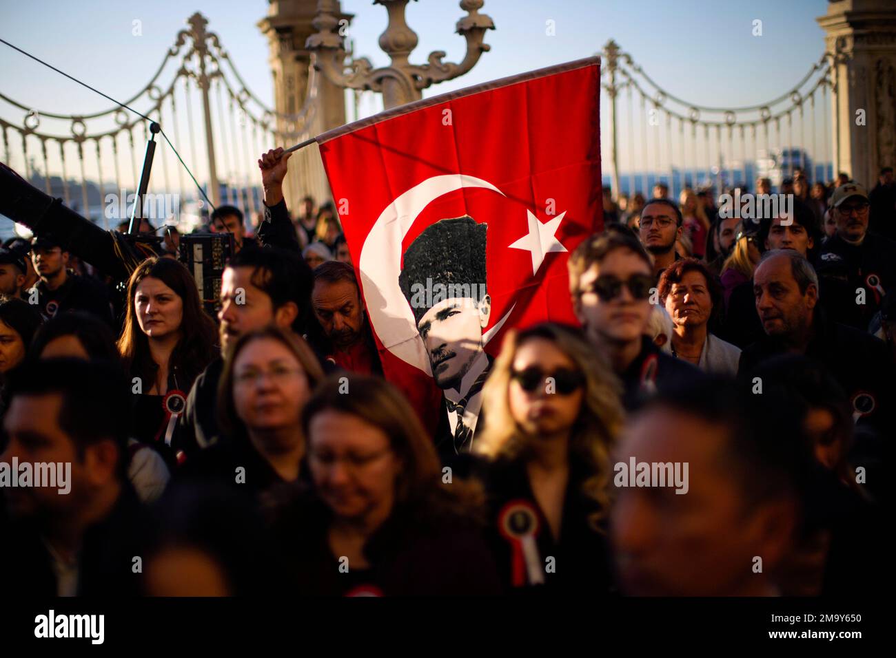 People observe a minute of silence to mark the 84th anniversary of ...