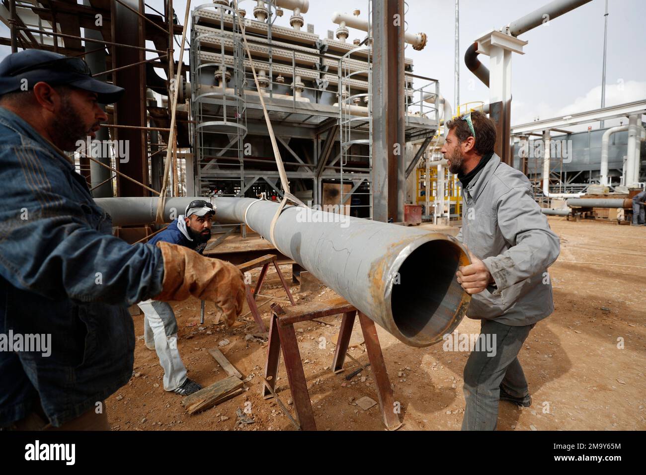 Men work at a gas facility in Homs province, Syria, Wednesday, Nov. 9 ...