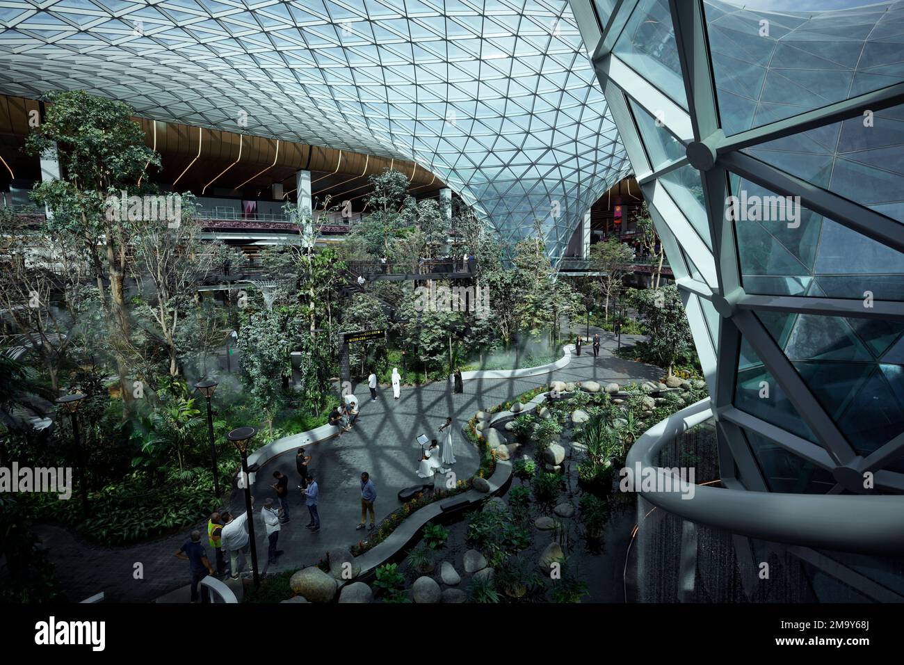 People walk at the new central concourse terminal expansion new airport ...