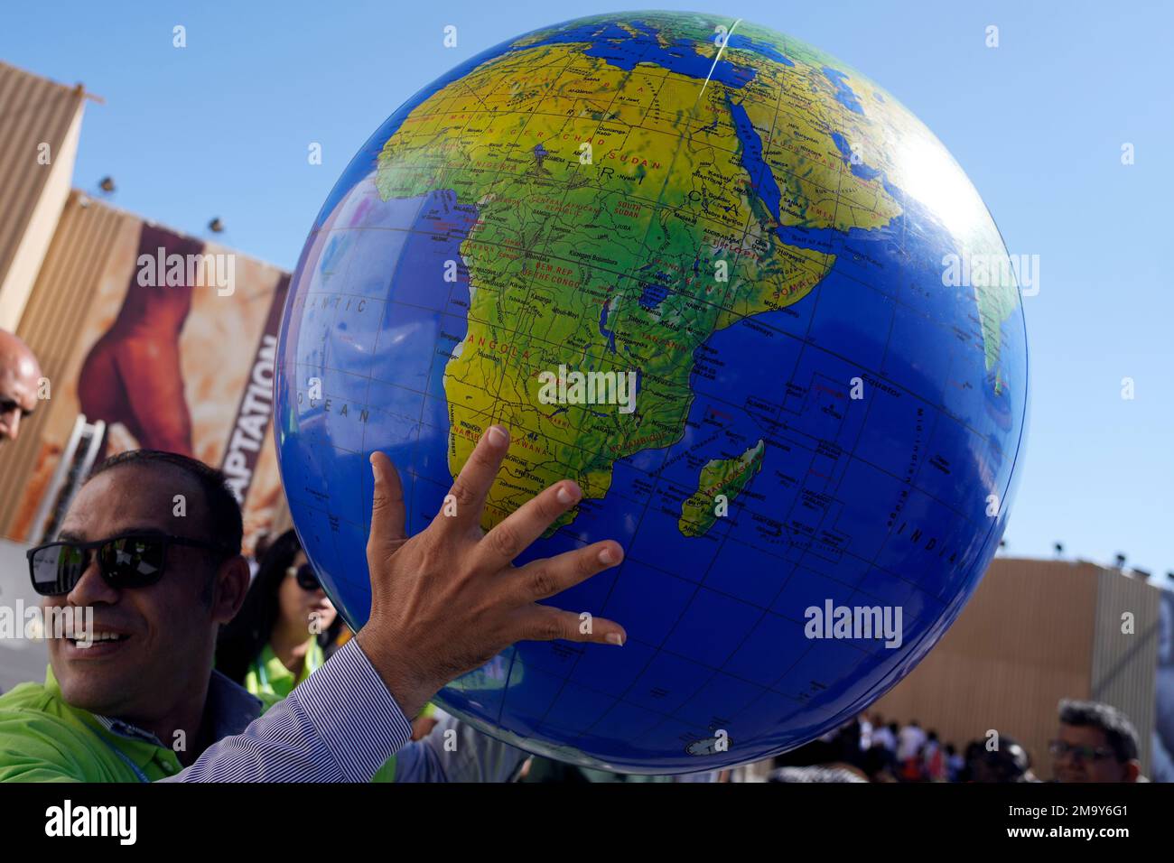 Demonstrators hold a globe during the COP27 U.N. Climate Summit ...
