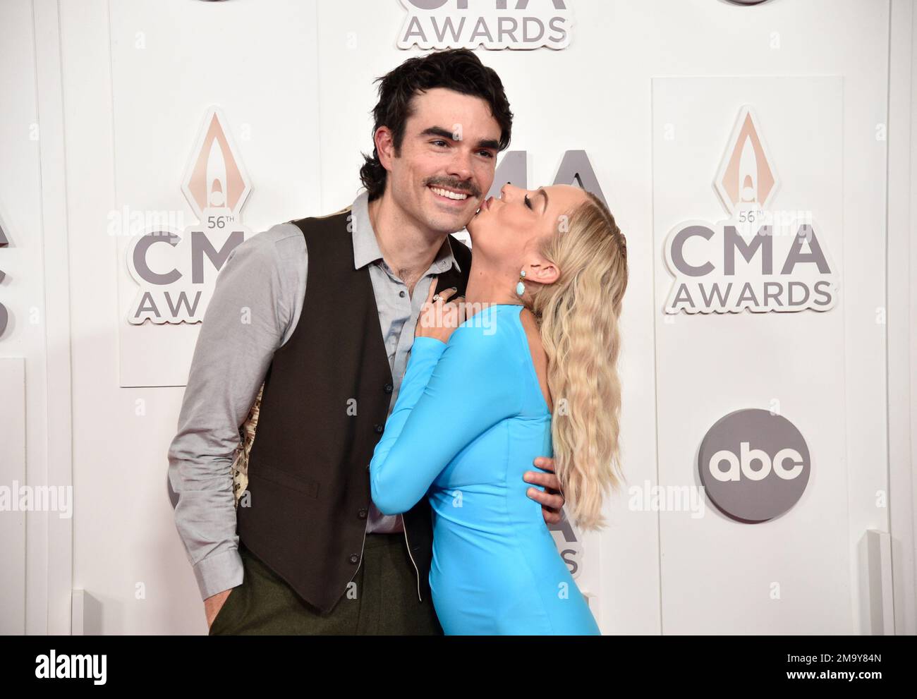 MacKenzie Porter, right, kisses Jake Etheridge as they arrive at the ...