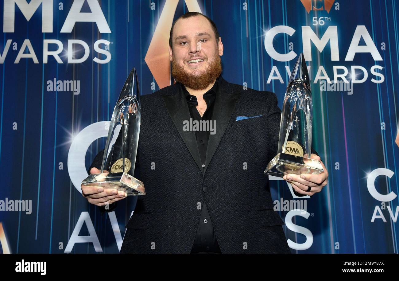 Luke Combs poses in the press room with the awards for album of the ...