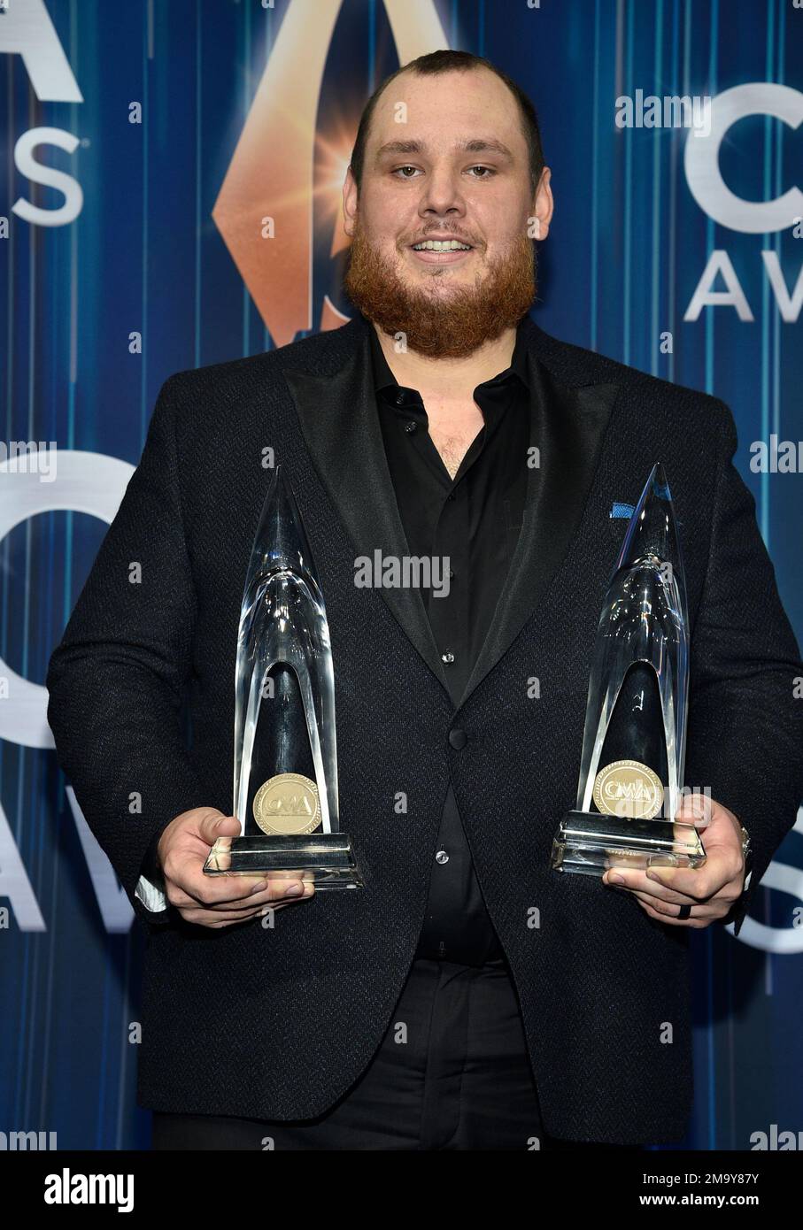 Luke Combs Poses In The Press Room With The Awards For Album Of The