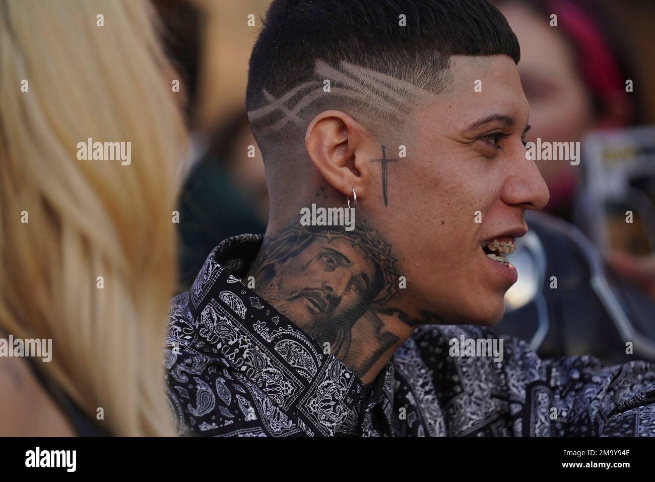 Rapper Santa Fe Klan talks to fans on the red carpet at the premiere of ...