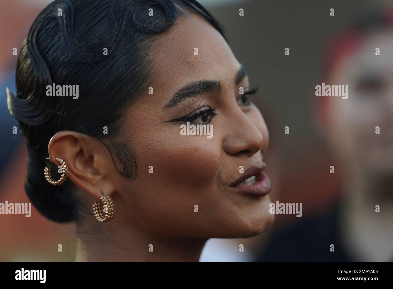 Mabel Cadena talks with fans on the red carpet at the premiere of Black ...