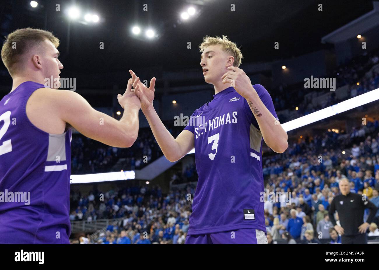 St. Thomas' Ryan Dufault, left, does a special handshake with teammate ...