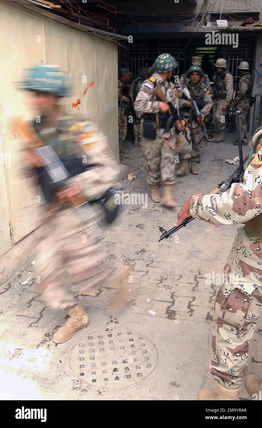 Members of the Iraqi Civil Defense Corp (ICDC) provide support during a ...