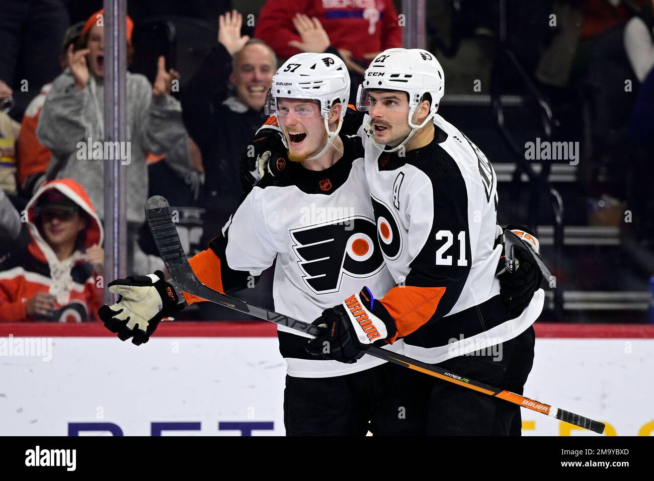 Philadelphia Flyers' Wade Allison, left, celebrates his goal with Scott ...