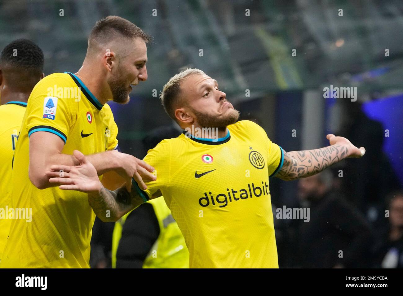 Inter Milan's Federico Dimarco, right, celebrates after scoring his ...