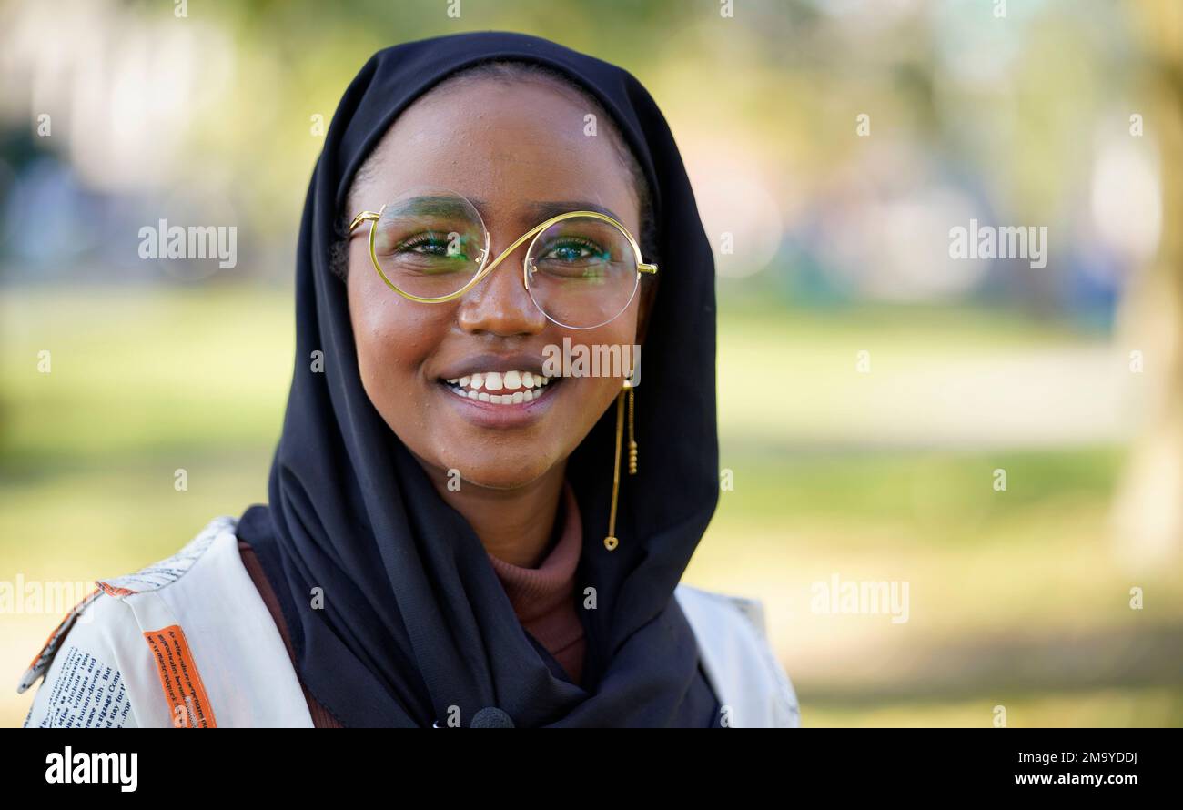 FILE - Mana Abdi, 26, speaks with a reporter in this Oct. 6, 2022 file photo in Lewiston, Maine ...