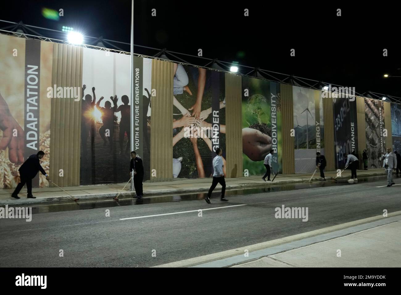 Workers clean a sewage leak at the COP27 U.N. Climate Summit, Wednesday ...