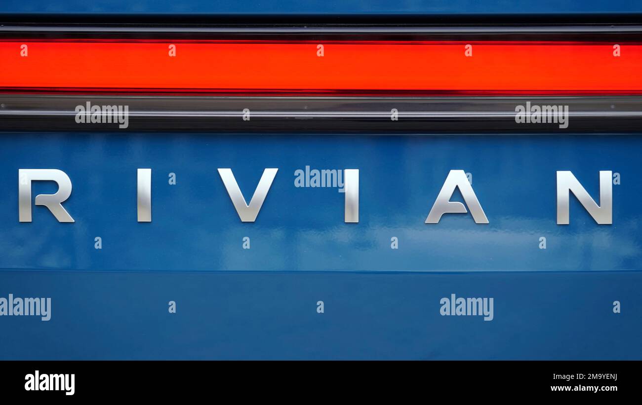 FILE - A Rivian logo is shown on one of the company's electric pickup ...