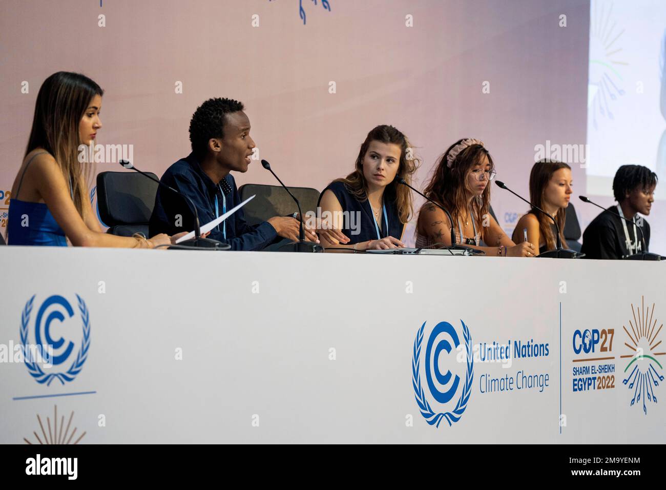 Eric Njuguna, of Kenya, second from left, speaks with other youth ...
