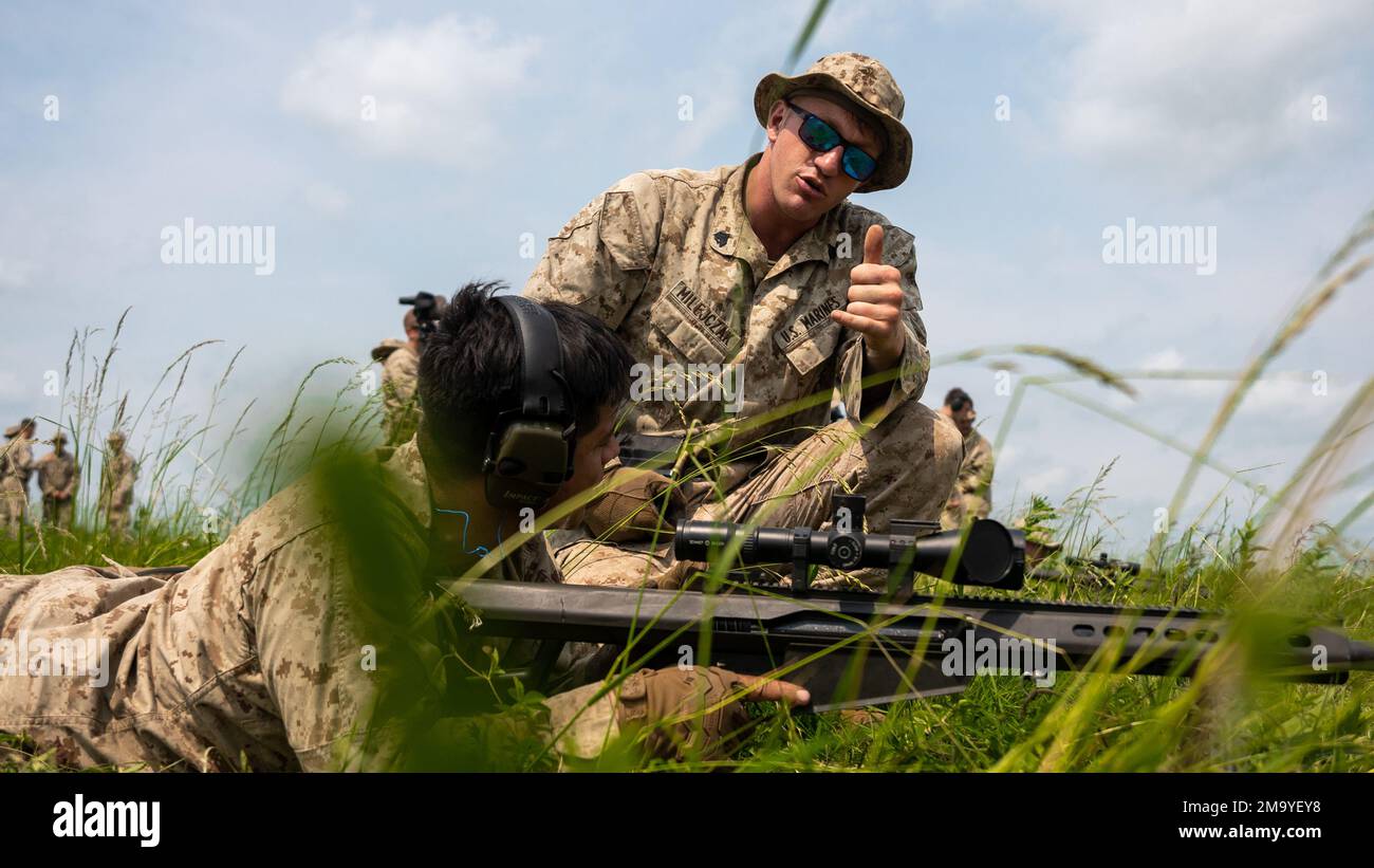 U.S. Marine Corps Sgt. Alec Milejczak, right, a scout sniper assigned ...
