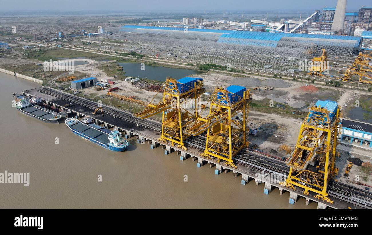Ships with coal dock at the Maitree Super Thermal Power Project near ...