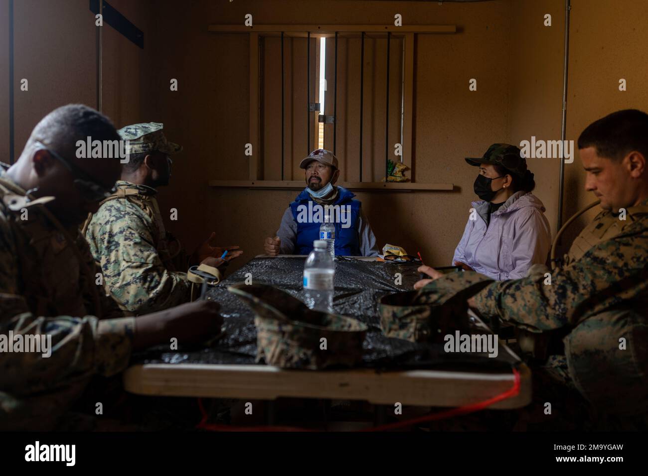 U.S. Marines with 1st Civil Affairs Group speak with a roleplayer ...