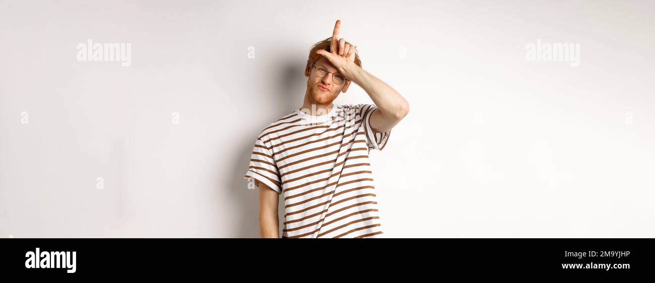 Sassy and arrogant redhead man scolding lost team, showing loser ...