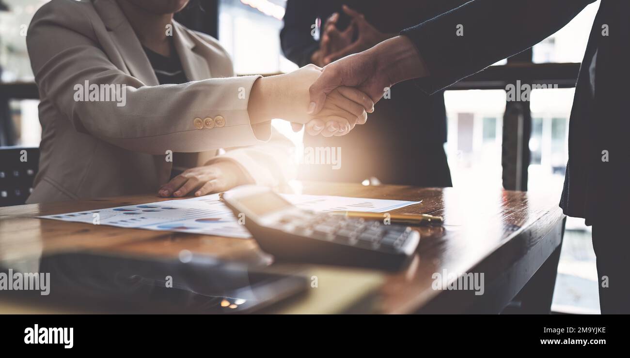 Business shaking hands. Successful businessmen handshaking after good ...