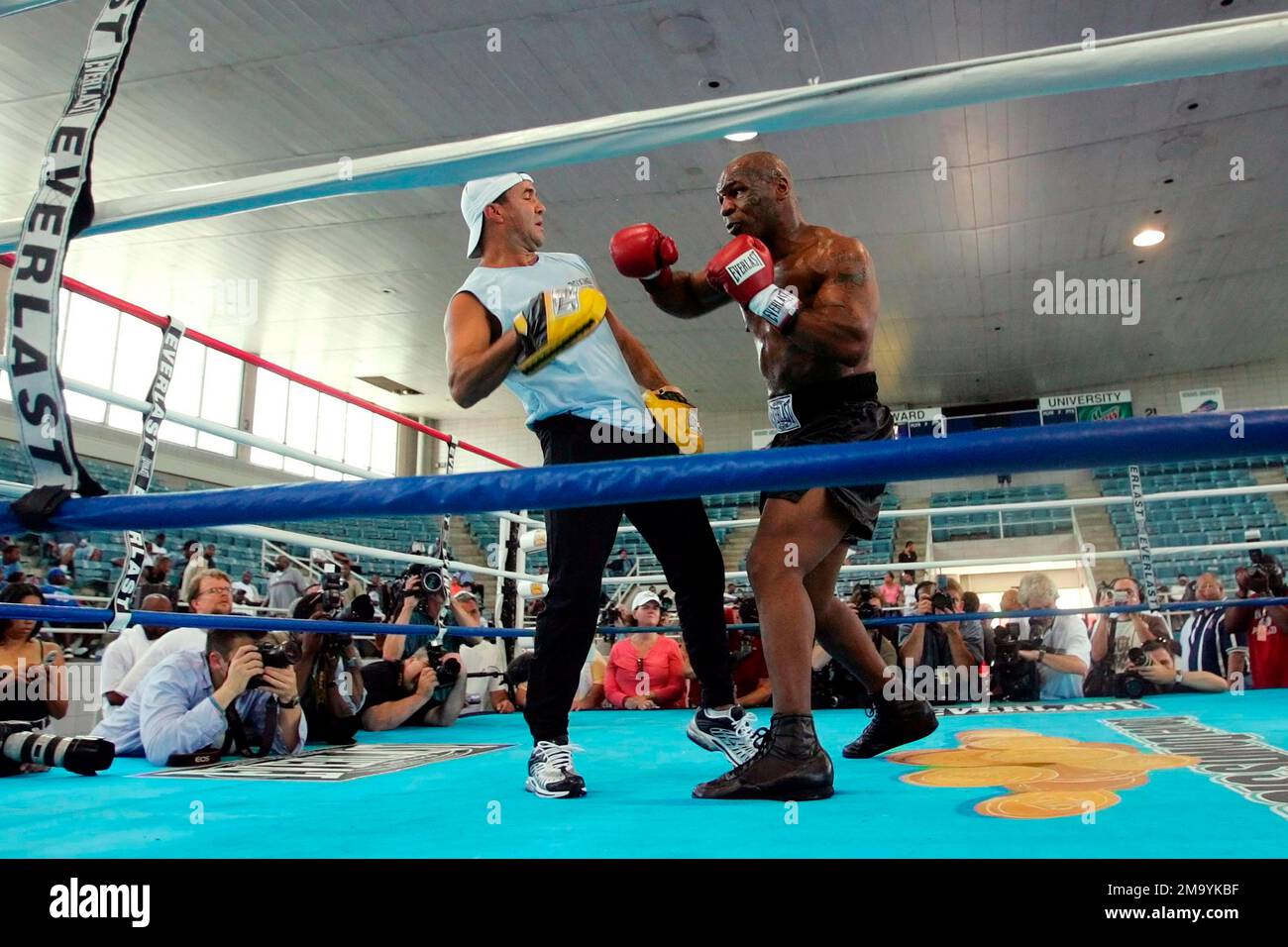 FILE - Former Heavyweight Champion Mike Tyson, right, spars with his ...