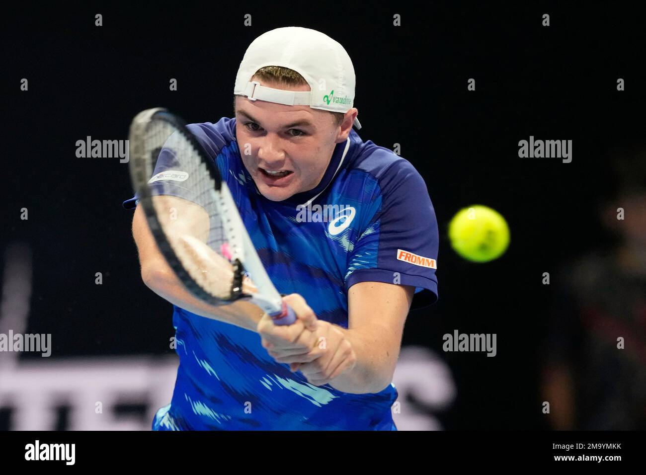 Switzerland's Dominic Stricker returns the ball to Britain's Jack ...