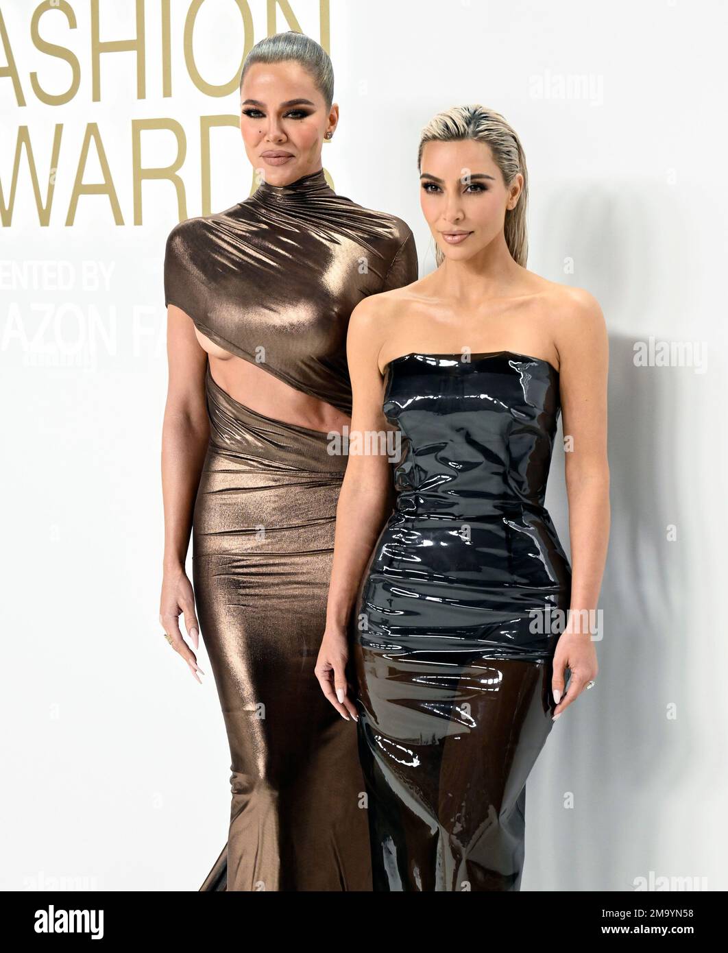 Khloe Kardashian, left, and Kim Kardashian attend the CFDA Fashion ...