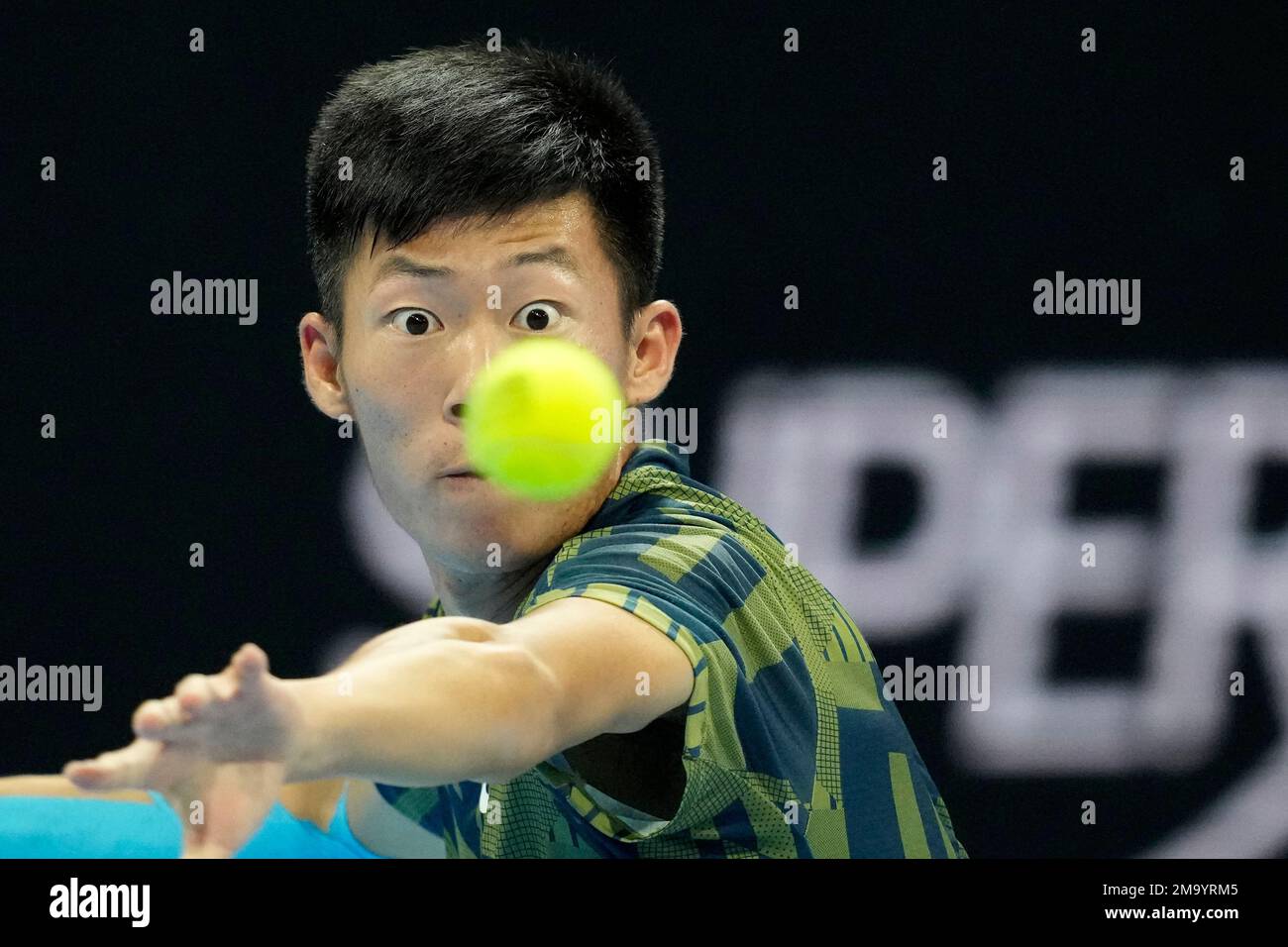 Taiwan's Tseng Chun-hsin returns the ball to Italy's Lorenzo Musetti ...