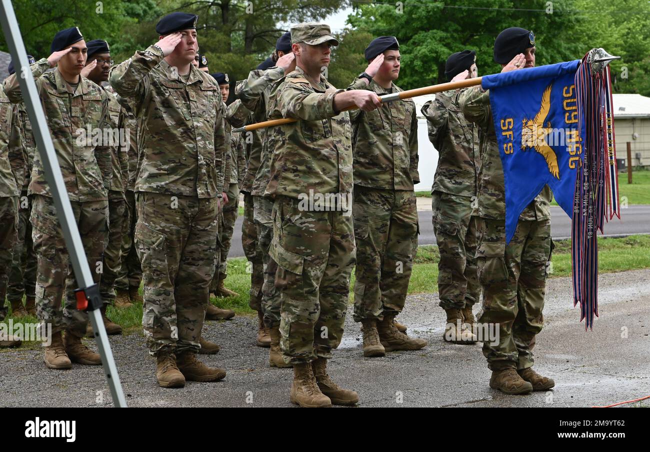 Members of the 509th Security Forces Squadron render a salute during ...