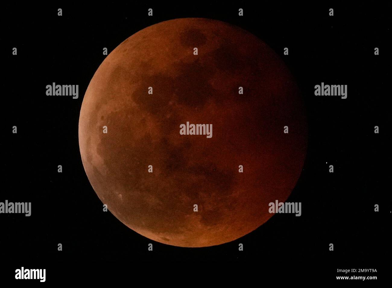 The moon rises during a lunar eclipse in Metro Manila, Philippines ...