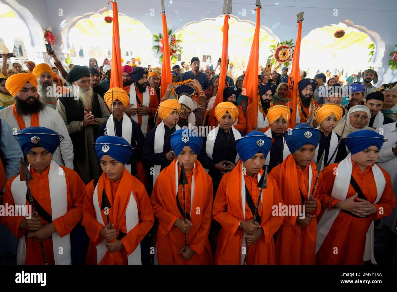 Sikh boys in traditional dress attend a religious ceremony to celebrate ...