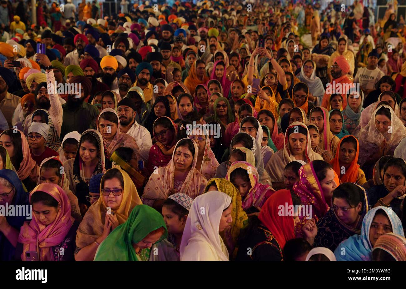 Sikh devotees offer prayers during a religious congregation to mark the ...