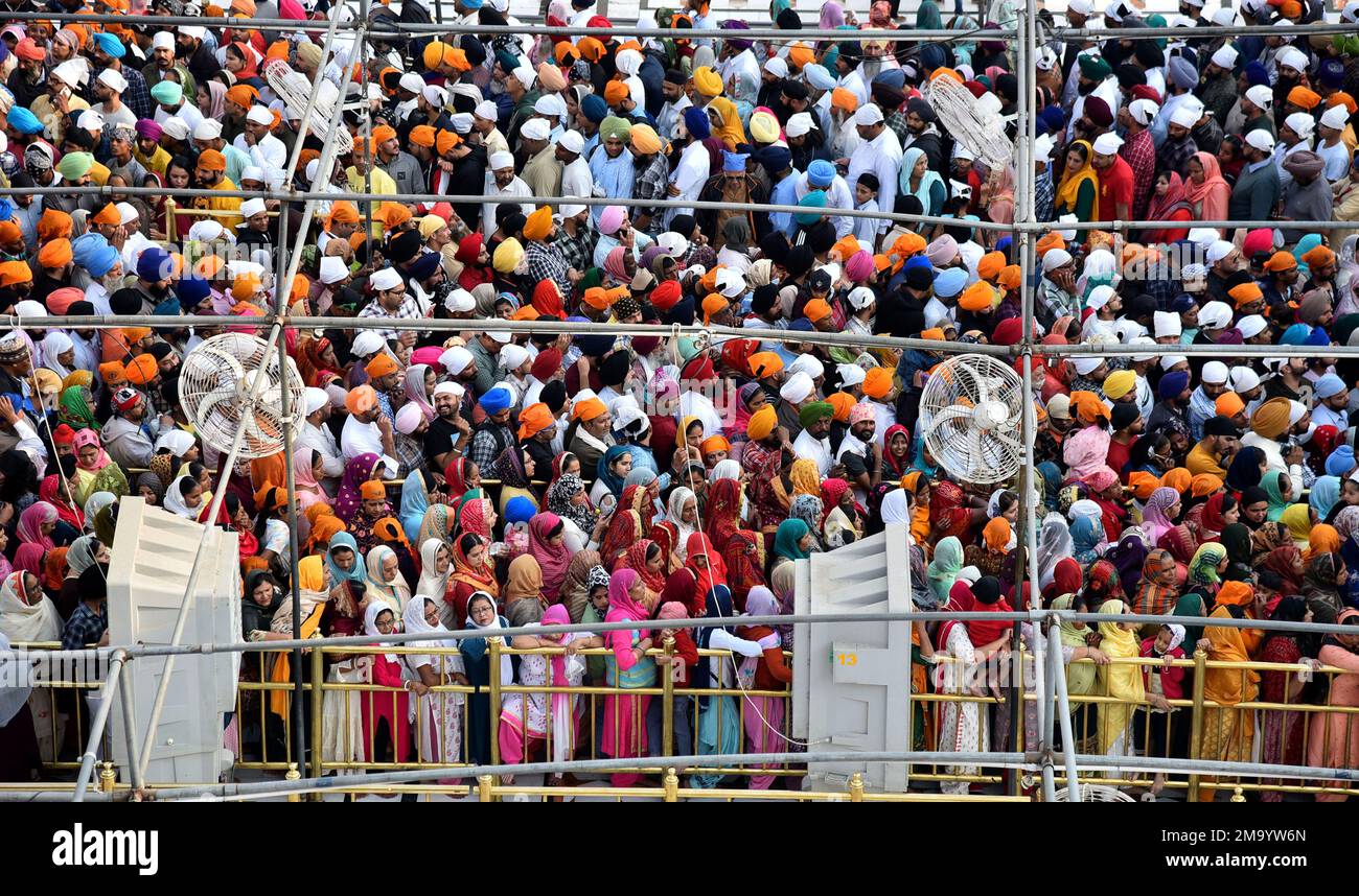 Sikh devotees stand in queues to pay obeisance at the Golden Temple on ...