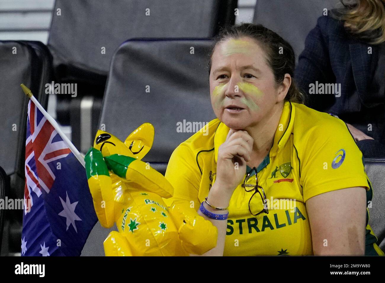 A supporter of Storm Sanders of Australia watches the first day match ...