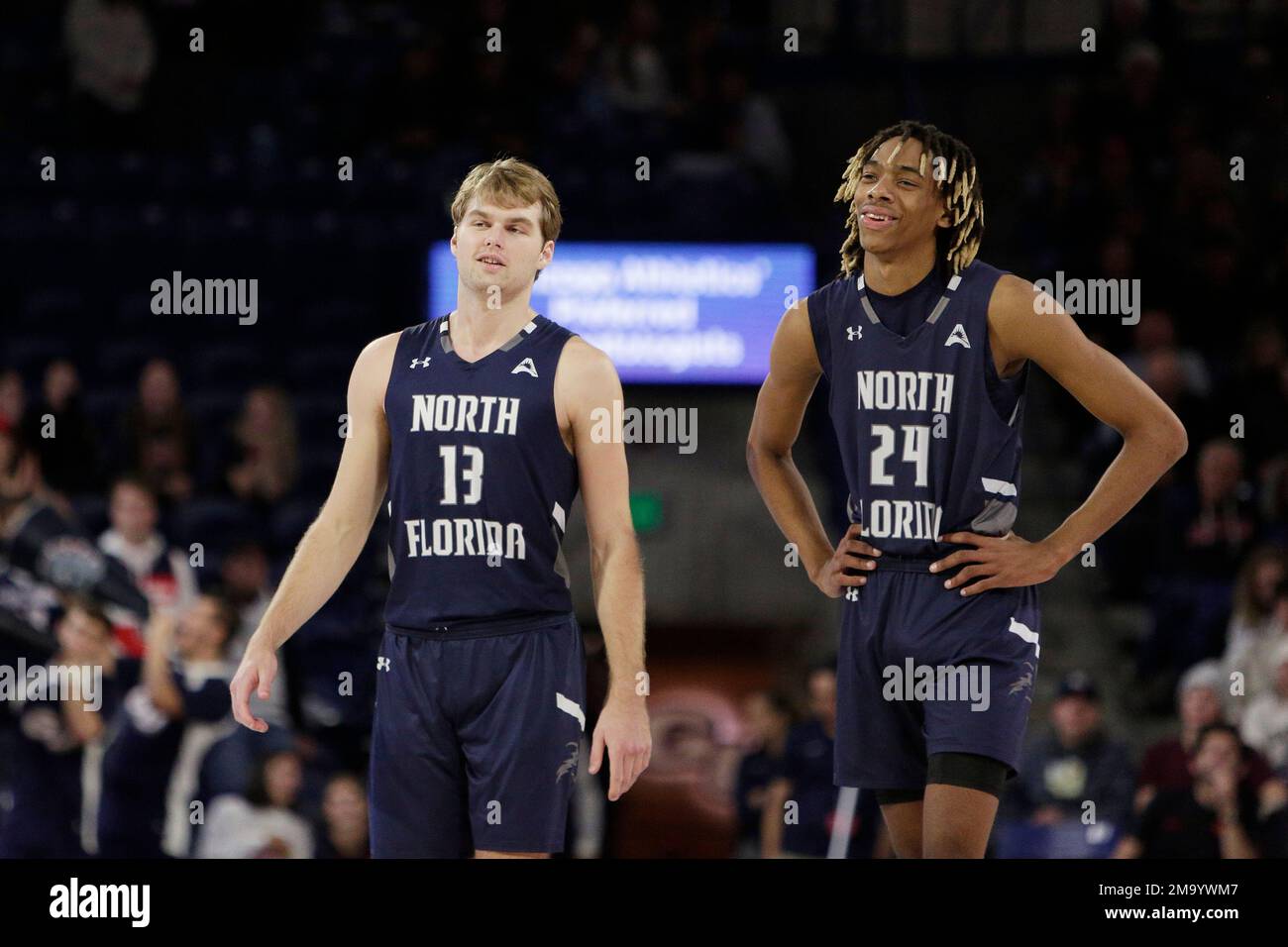 North Florida guard Max Hrdlicka (13) and North Florida forward Jadyn ...
