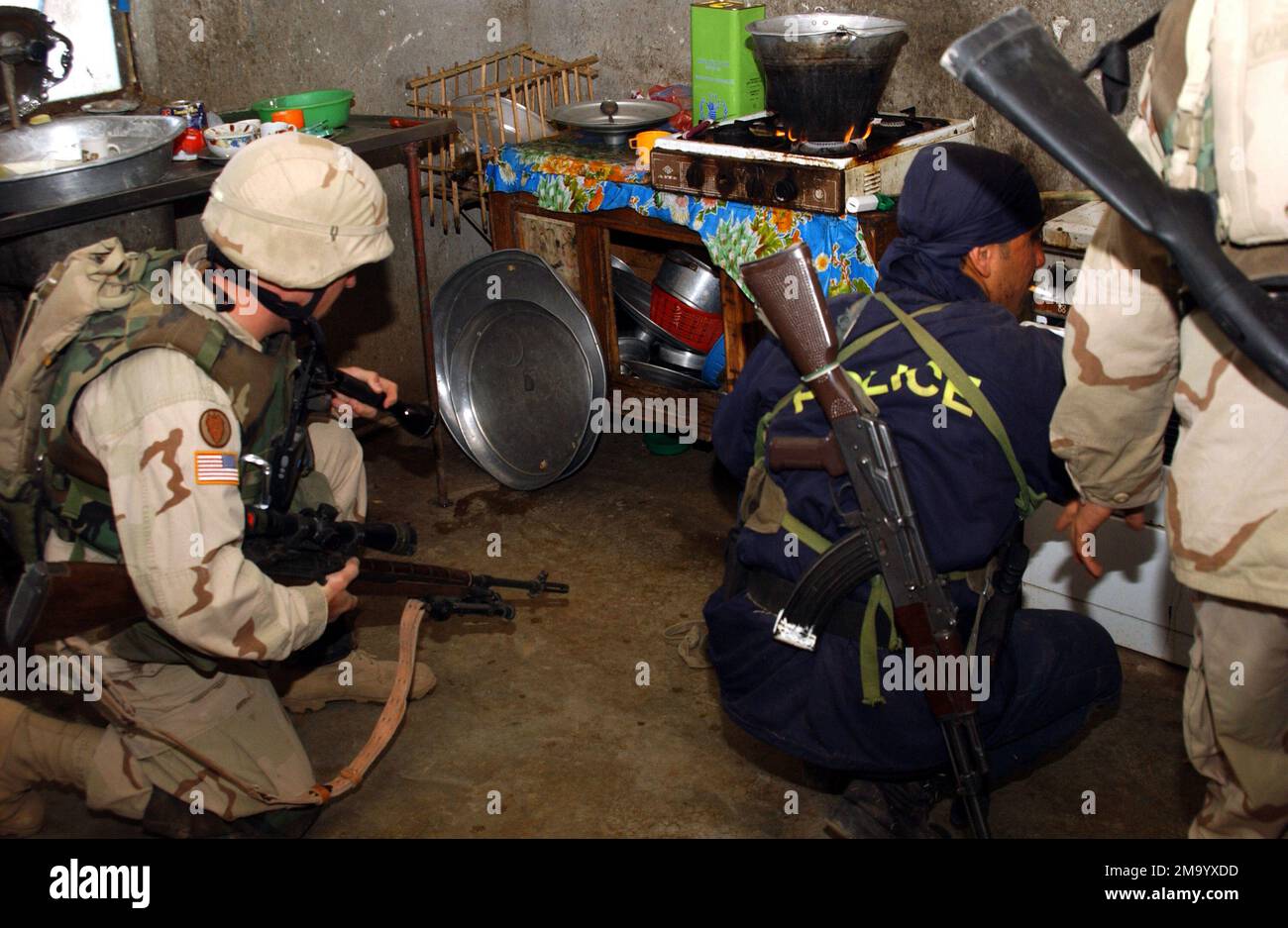 US Army (USA) STAFF Sergeant (SSG) Sean Lyles (left), Alpha Battery ...