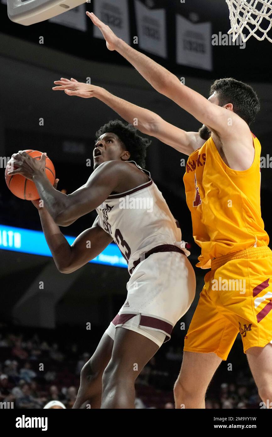 Texas A&M forward Solomon Washington (13) tries to shoot around ...