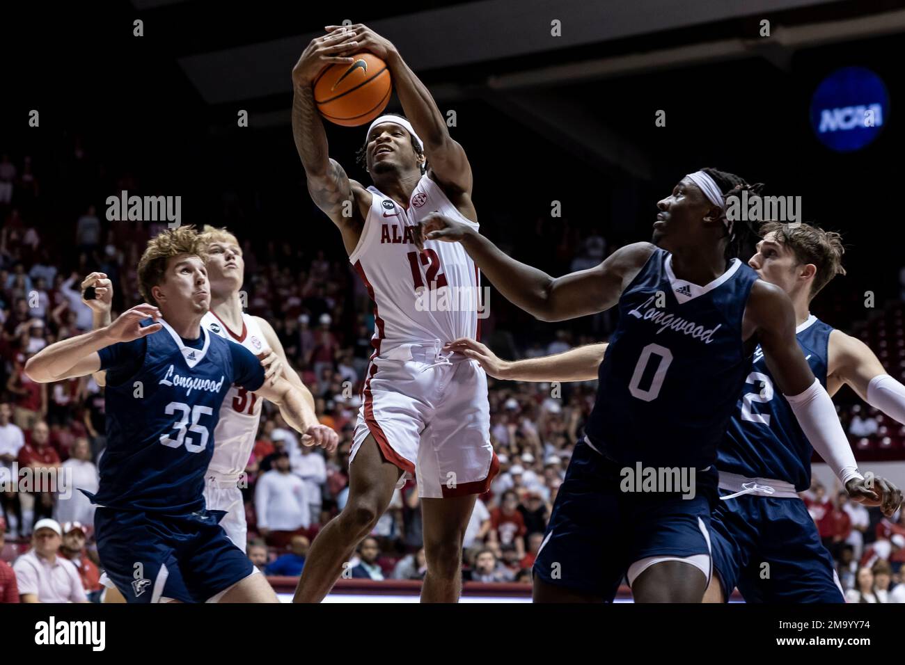Alabama guard Delaney Heard (12) grabs a rebound between Longwood ...