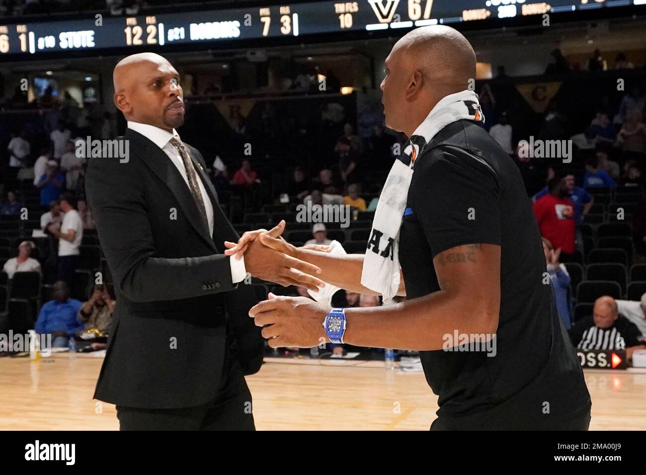 Vanderbilt head coach Jerry Stackhouse, left, shakes hands with Memphis ...