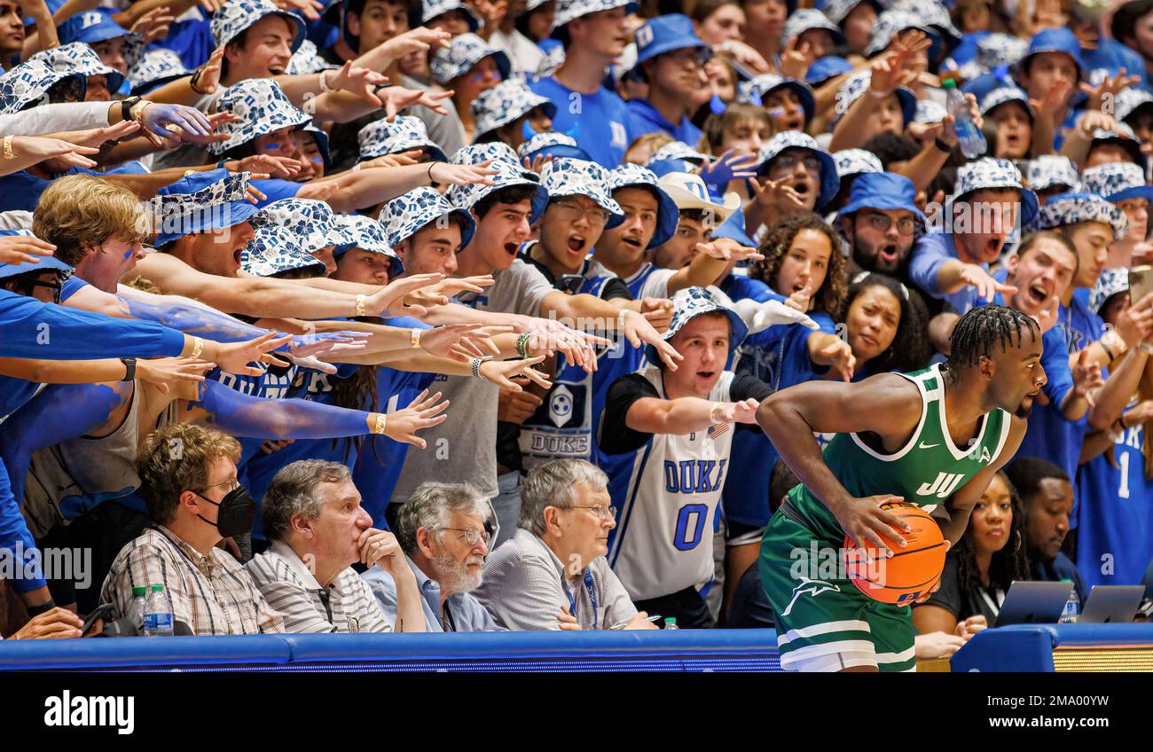 Jacksonville's Gyasi Powell, right, in-bounds the ball in front of the ...