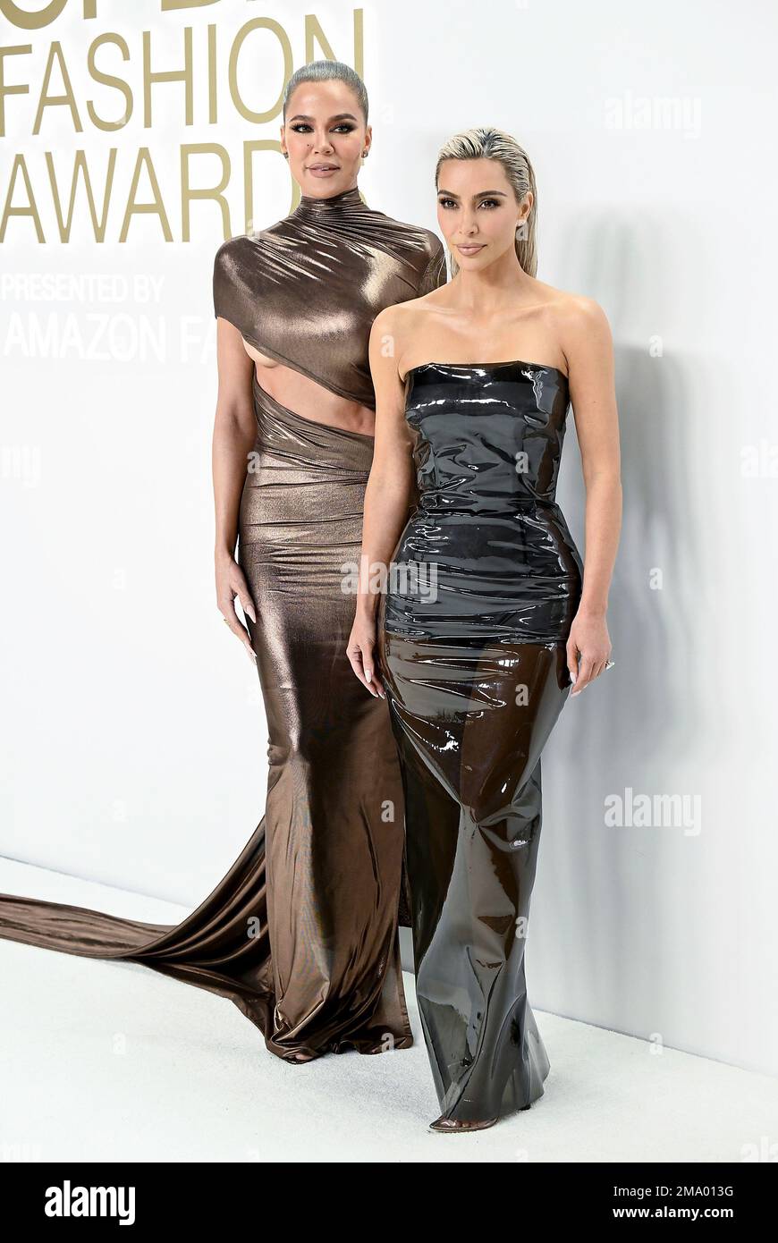Khloe Kardashian, left, and Kim Kardashian attend the CFDA Fashion ...