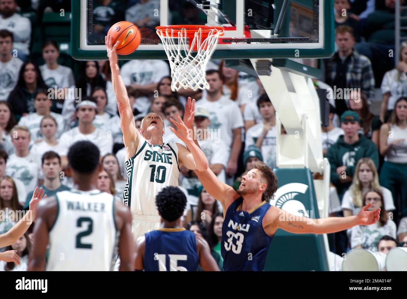 Michigan State's Joey Hauser (10) puts up a reverse layup against ...