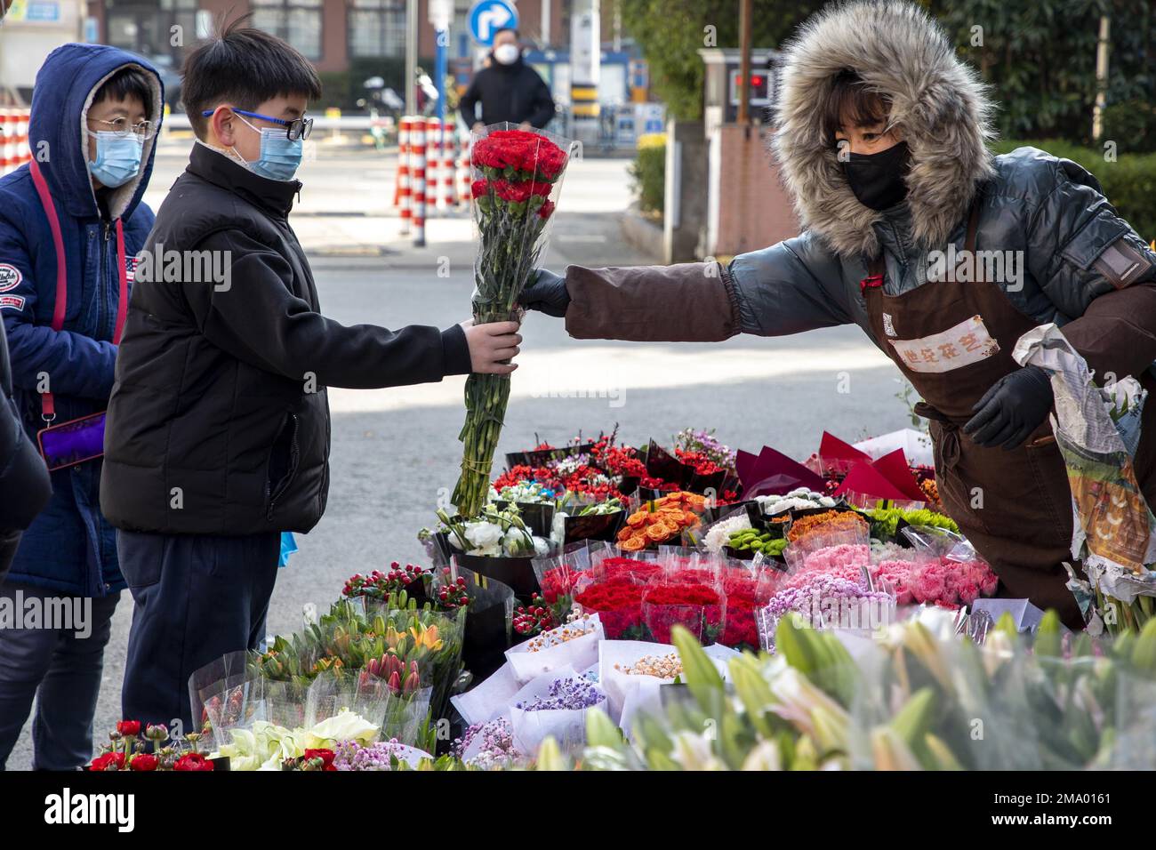 People select flowers for Spring Festival in a flower market in ...