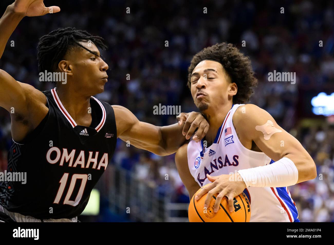 Kansas forward Jalen Wilson (10) drives against Omaha forward Marquel ...